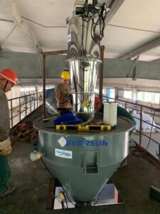 What type of conveying system is used to convey resin particles without ...